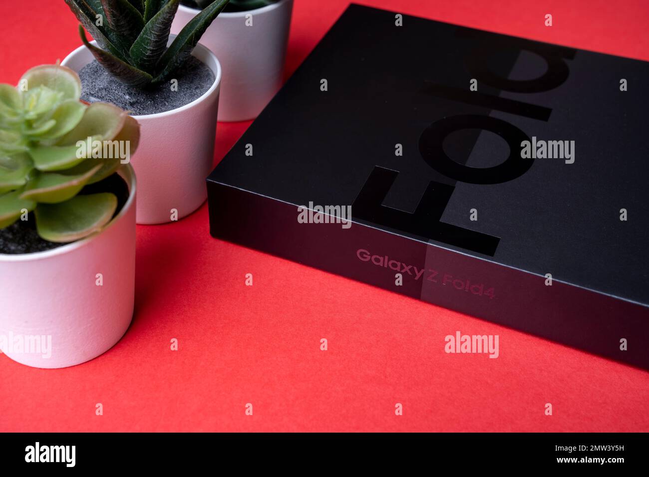 Samsung Galaxy Z Fold 4 in original box. Against a red background Stock ...