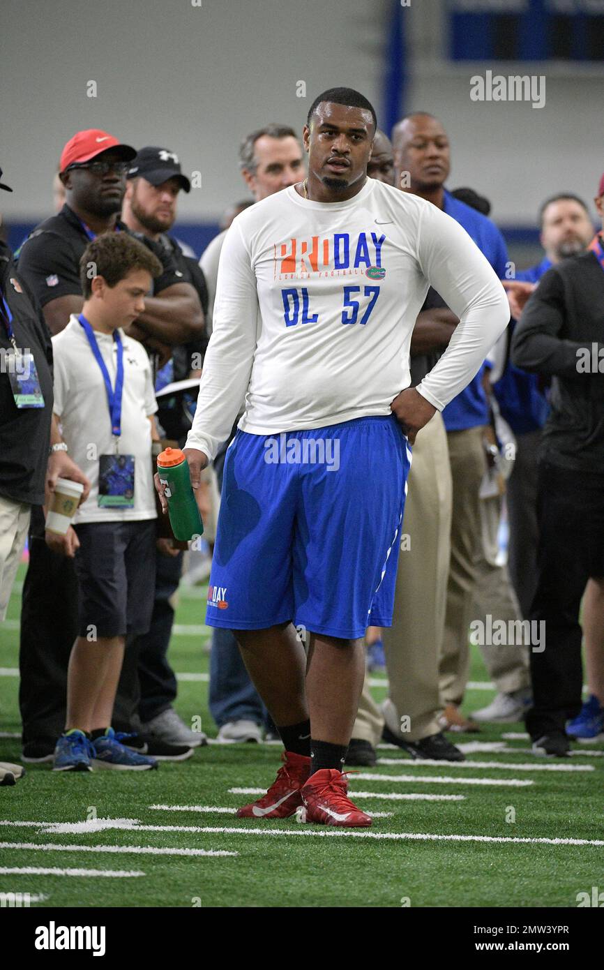 Defensive lineman Caleb Brantley (57) rests after running through a ...