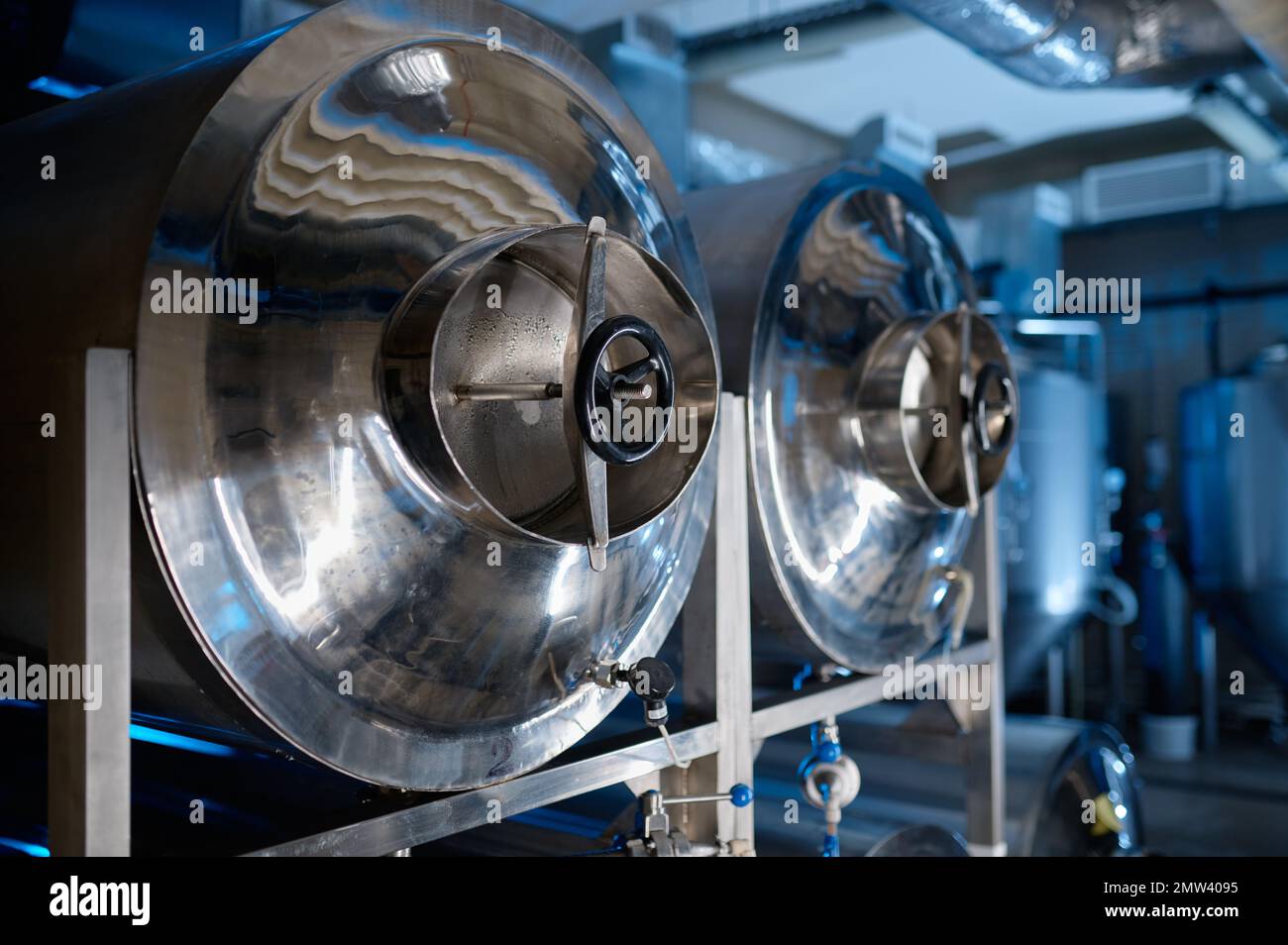 Industrial interior of modern craft brewery with metal beer tanks Stock ...