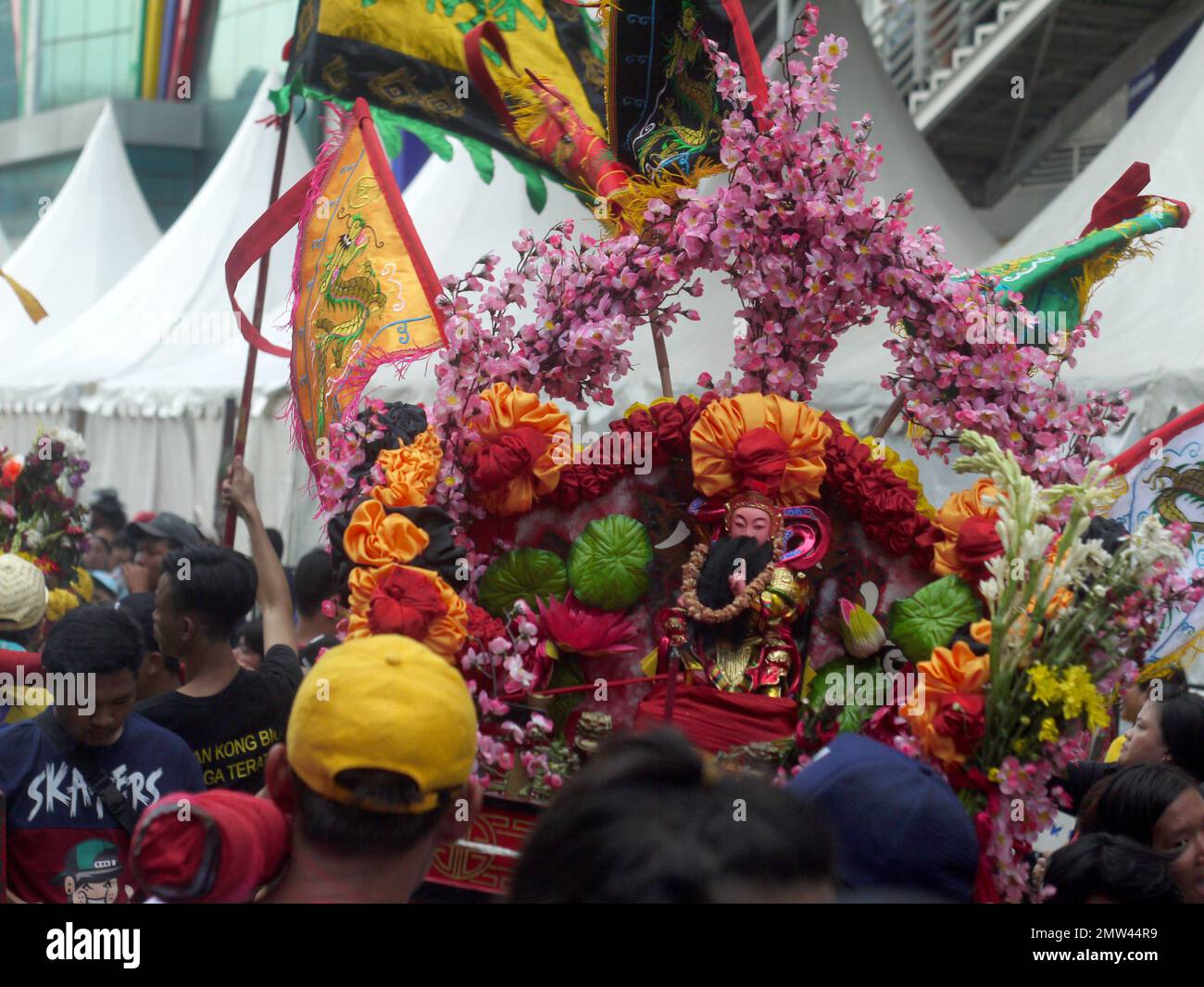 a parade carrying statues of Chinese gods during the Cap Go Meh ...