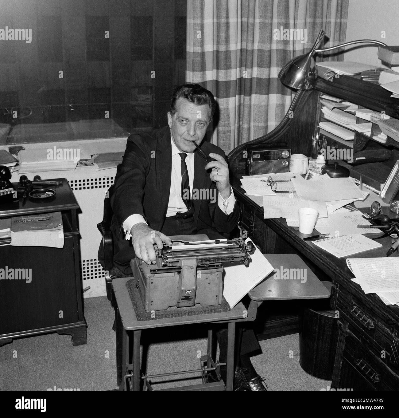 NBC's news commentator Chet Huntley prepares his script for the ...