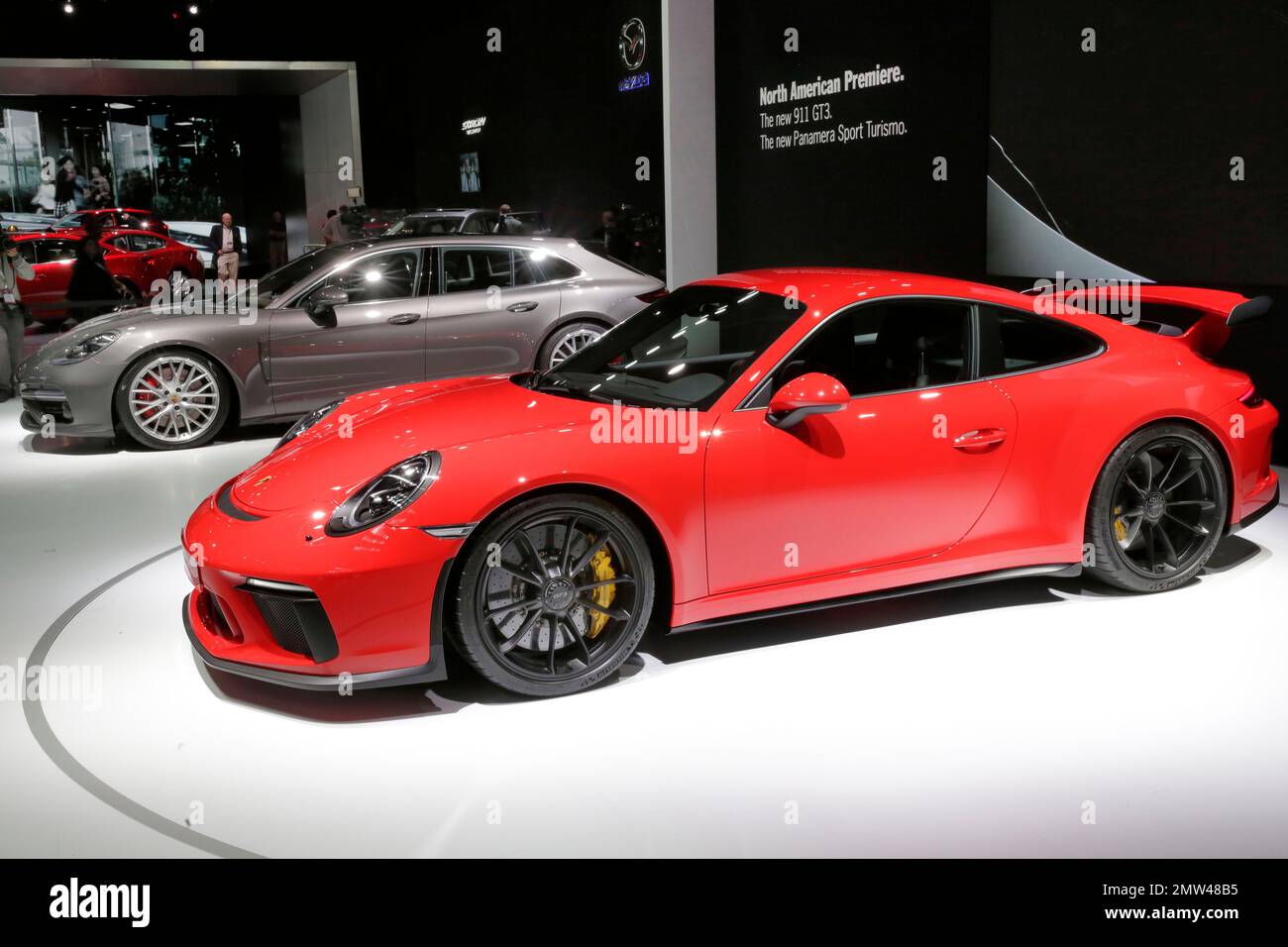 The Porsche 911 GT3, foreground, and Panamera Sport Turismo are shown ...