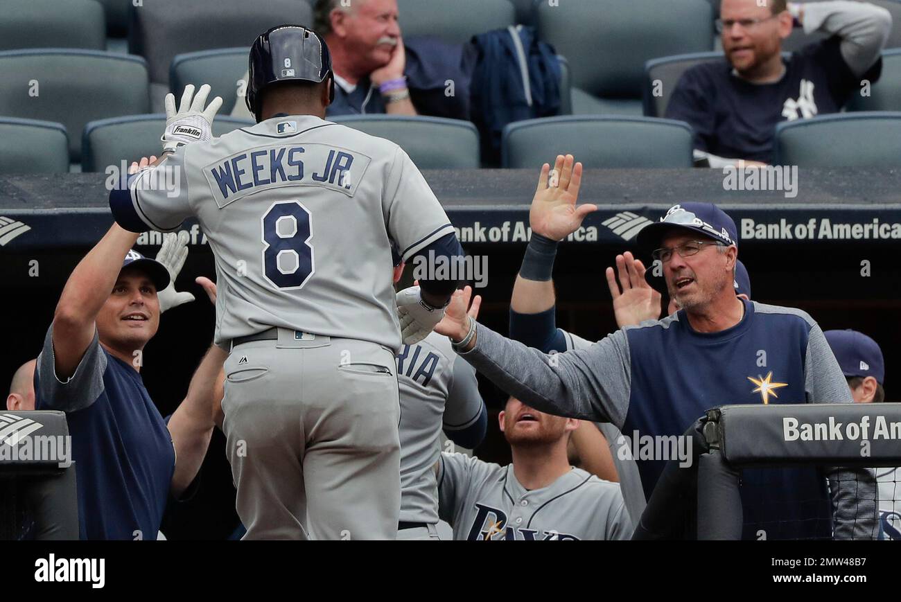 Tampa Bay Rays' Rickie Weeks Jr. (8) is congratulated by teammates ...