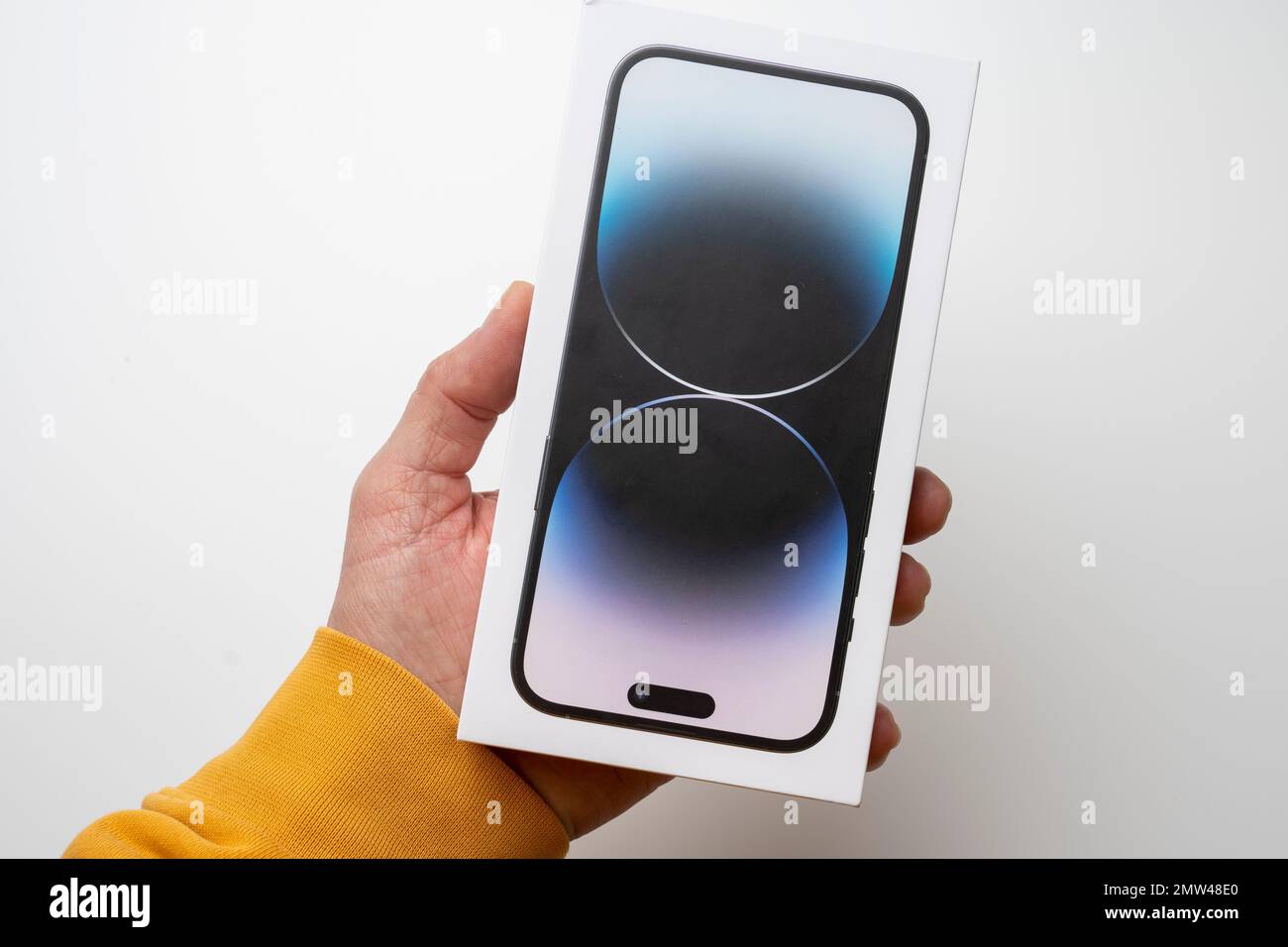 A man holds the latest iPhone 14 Pro Max in Space Black. Apple's latest ...