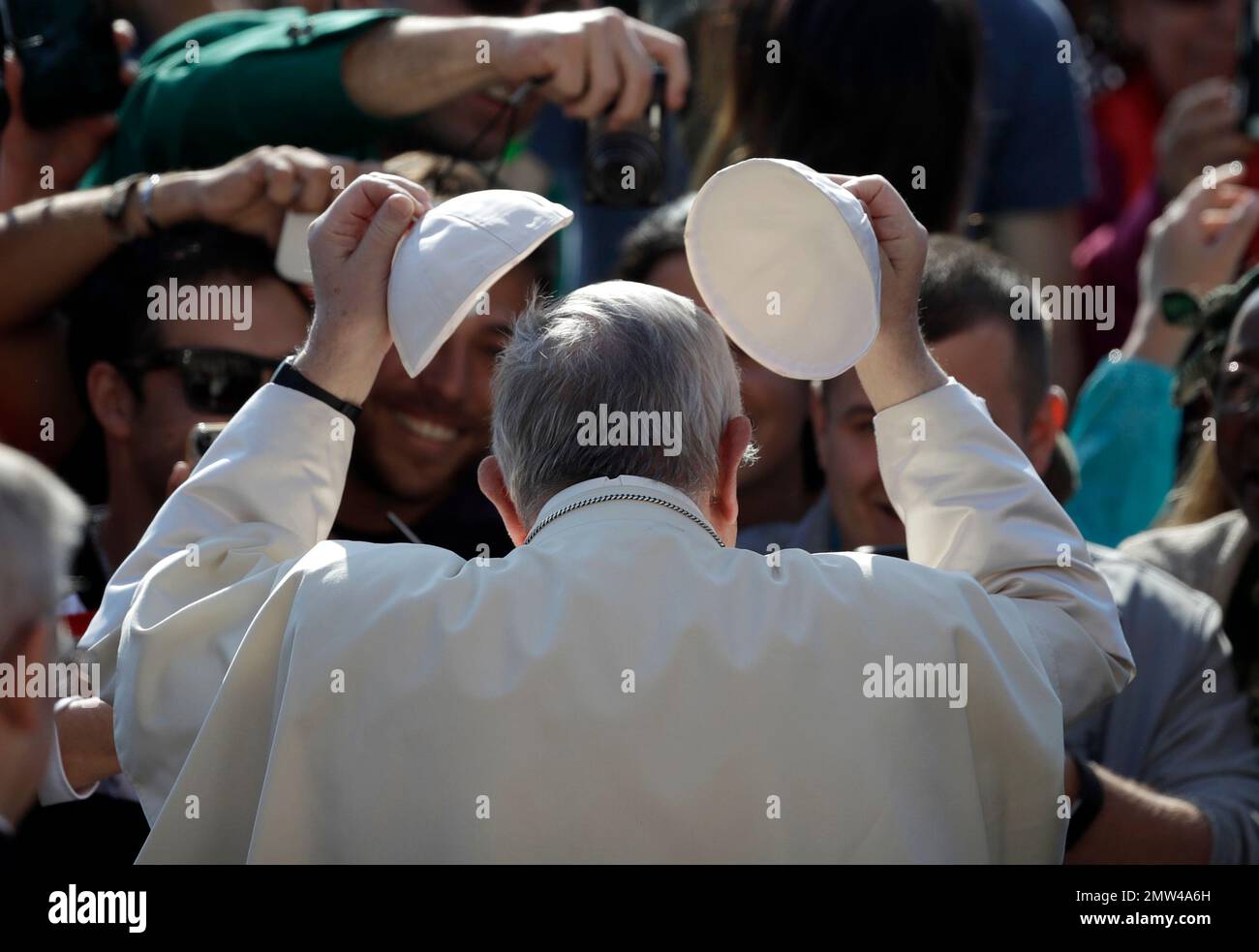Pope Francis exchanged his skull cap with one given to him from a ...