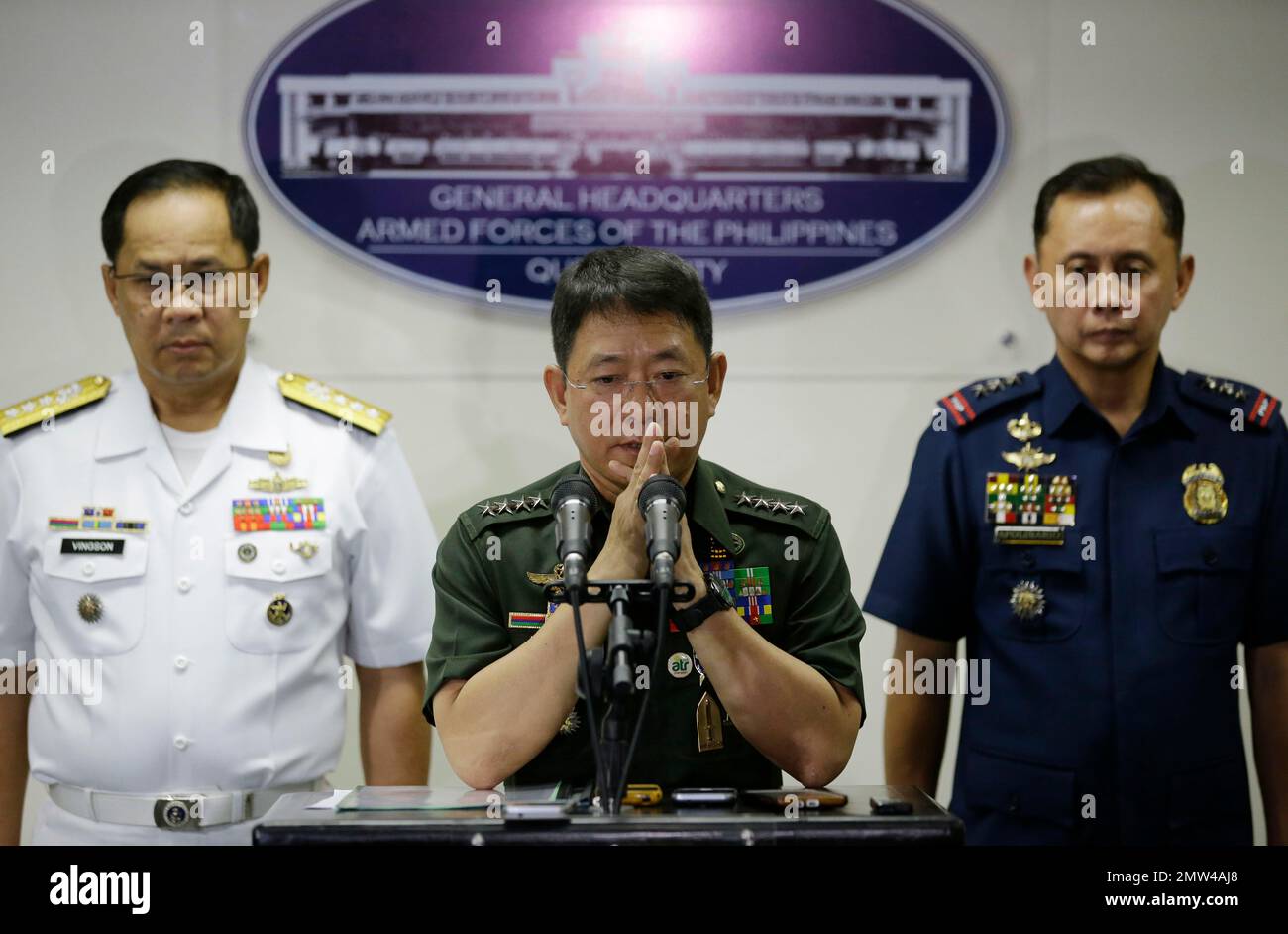 Philippine military chief of staff Gen. Eduardo Ano, center, gestures ...