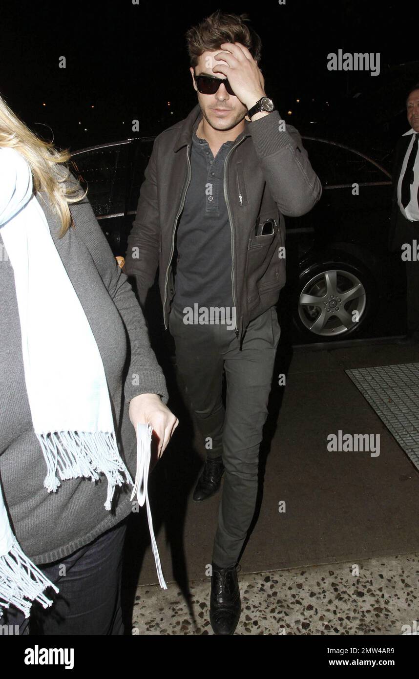 "New Year's Eve" star Zac Efron attempts to keep it cool by wearing ...