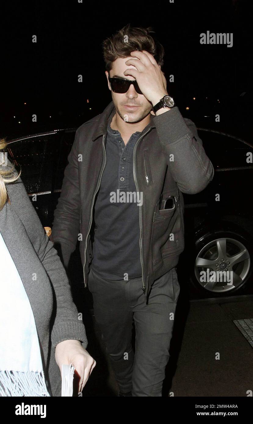 "New Year's Eve" star Zac Efron attempts to keep it cool by wearing ...