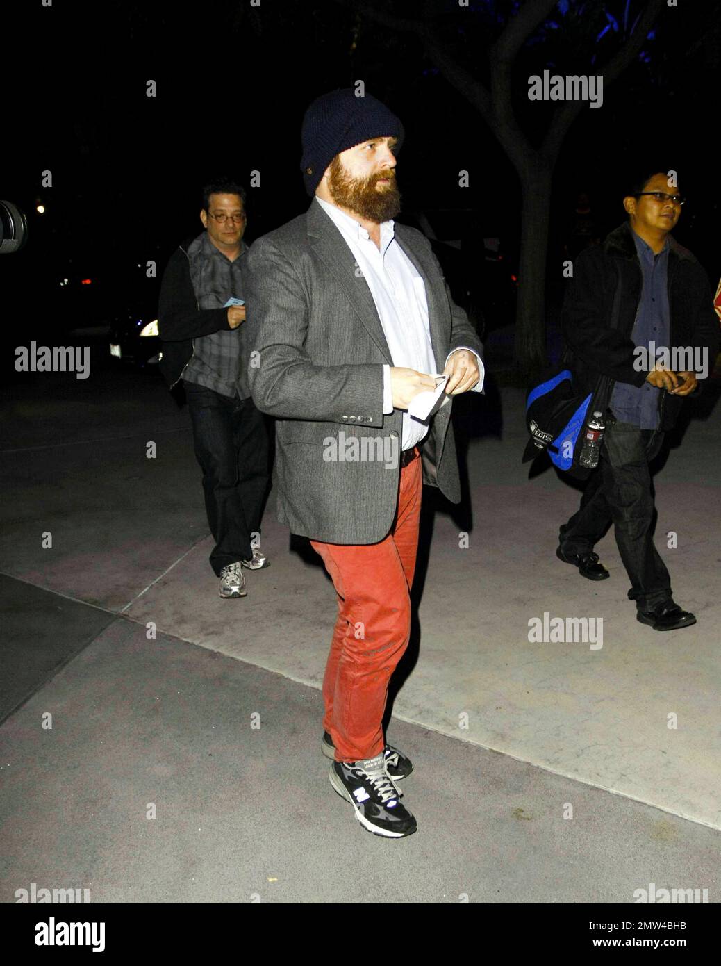 In red pants and a grey blazer actor Zach Galifianakis does his best to ...