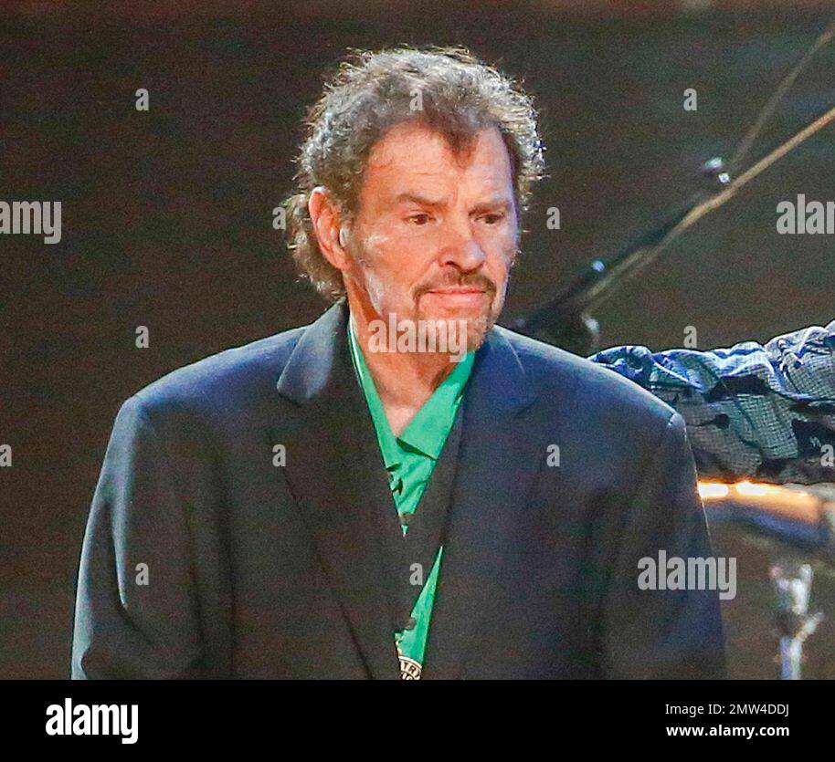 FILE - In this April 6, 2017 file photo, guitarist and fiddle player ...