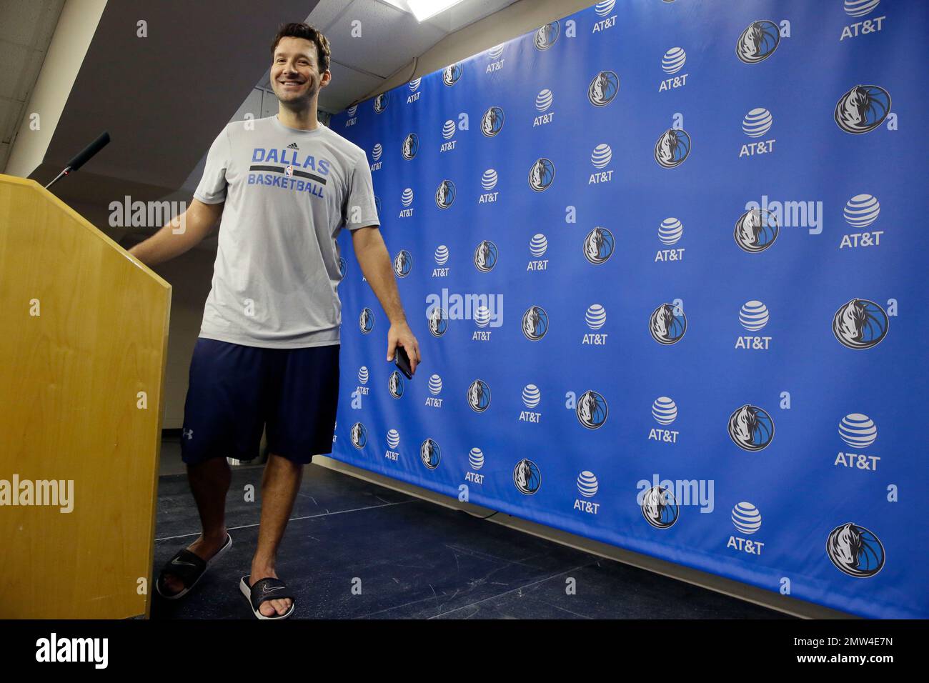 Former Dallas Cowboys quarterback Tony Romo smiles as he ends a news ...