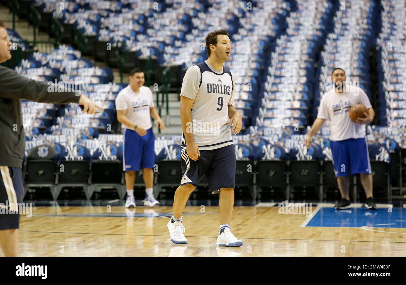 Former Dallas Cowboys quarterback Tony Romo walks the floor after a ...
