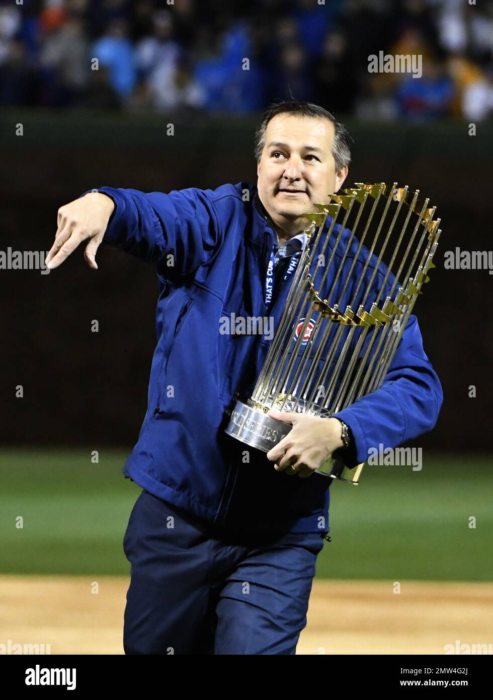 Cubs owner Tom Ricketts throws out a ceremonial first pitch before a ...