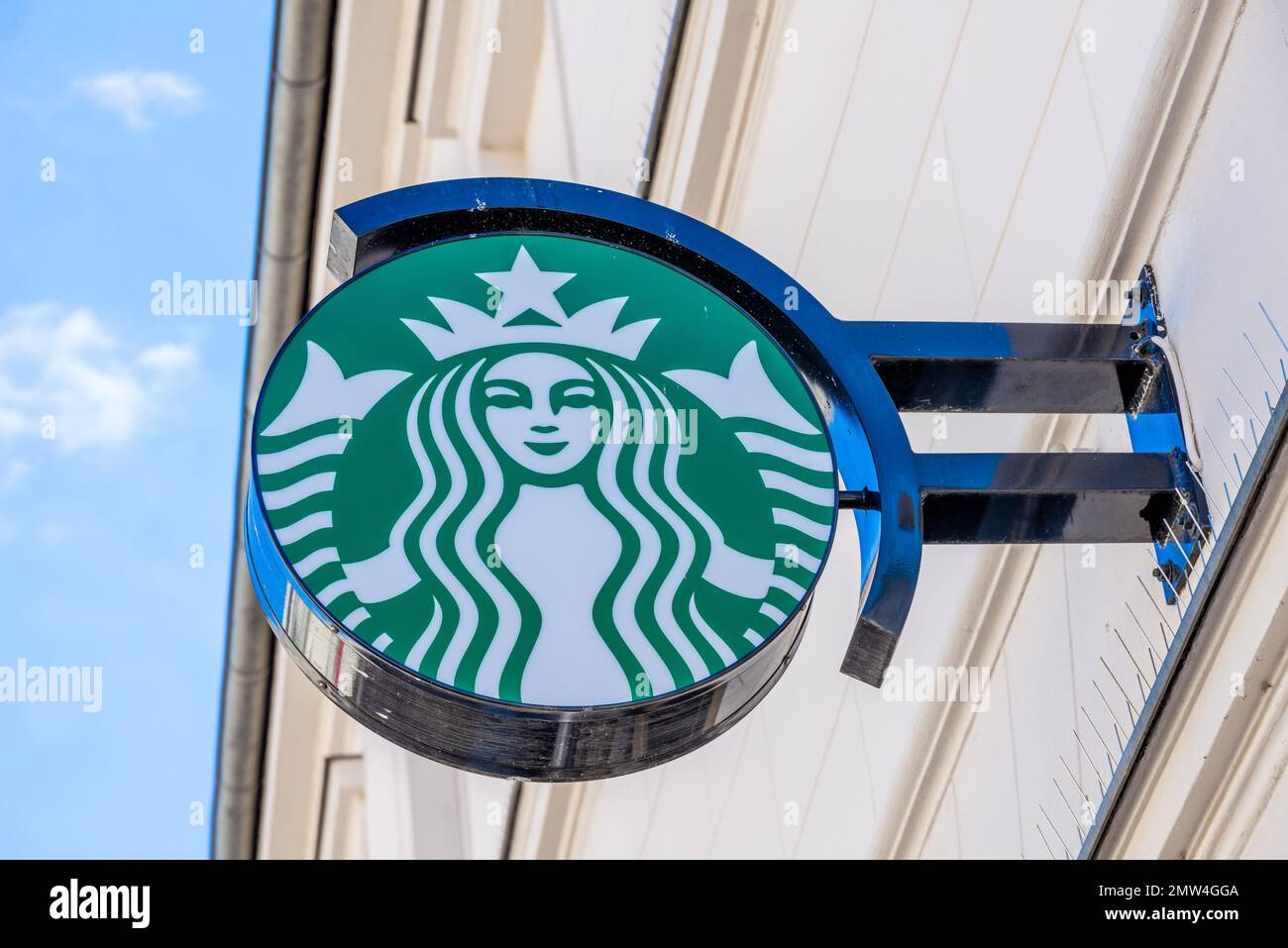 The Starbucks logo in green and white on a house wall in Potsdam Stock ...
