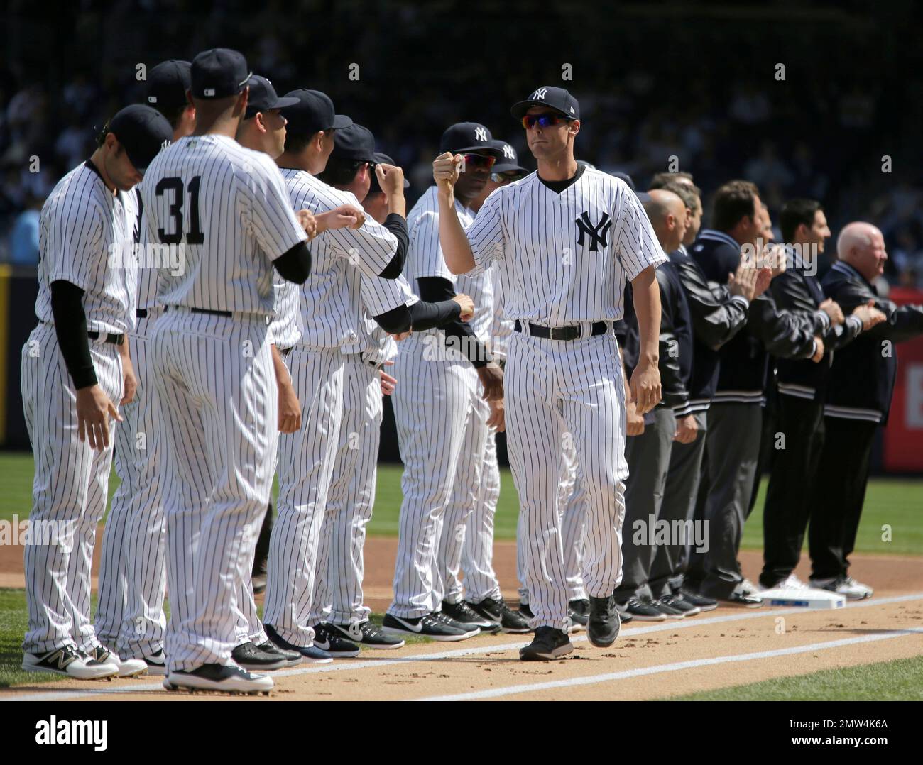 New York Yankees' Greg Bird greets teammates before the baseball game ...