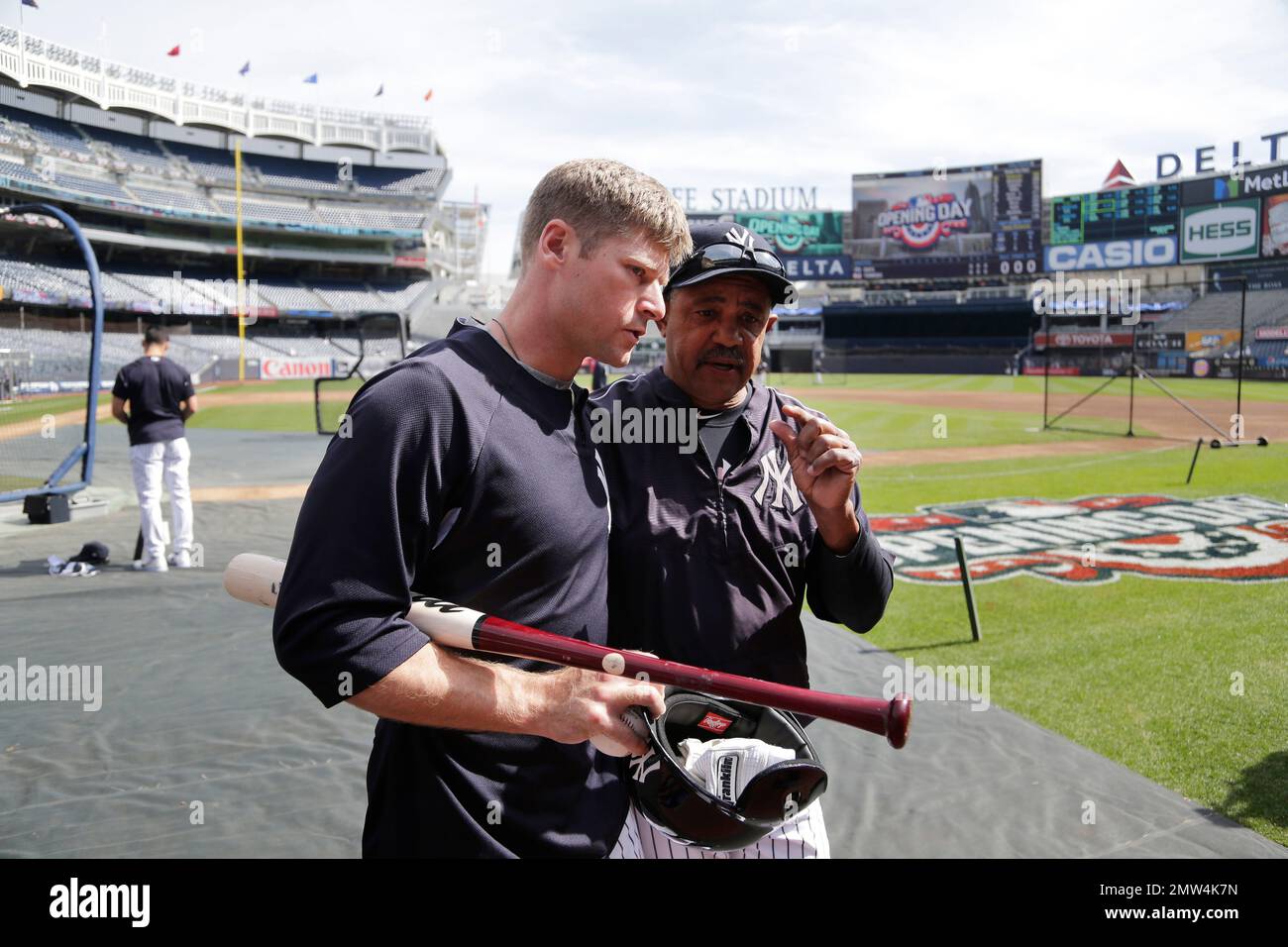 New York Yankees' Chase Headley, left, talks with third base coach Joe ...