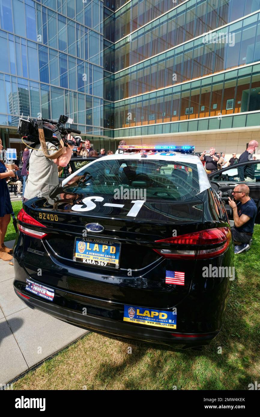 News media photograph a prototype of the Ford Fusion police hybrid car ...