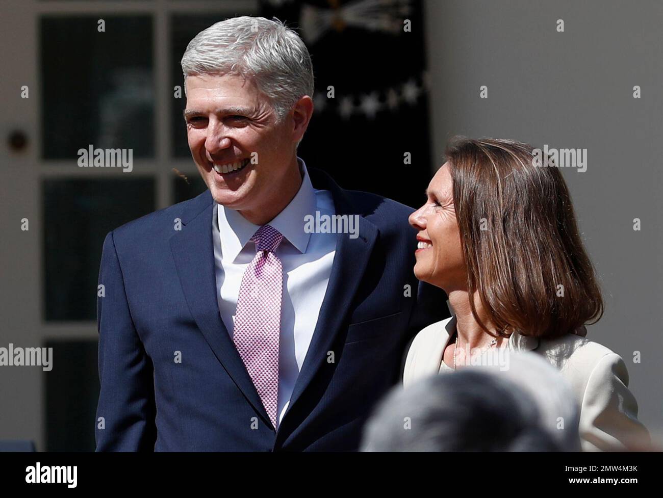 The newest Supreme Court Justice Neil Gorsuch stands with his wife ...