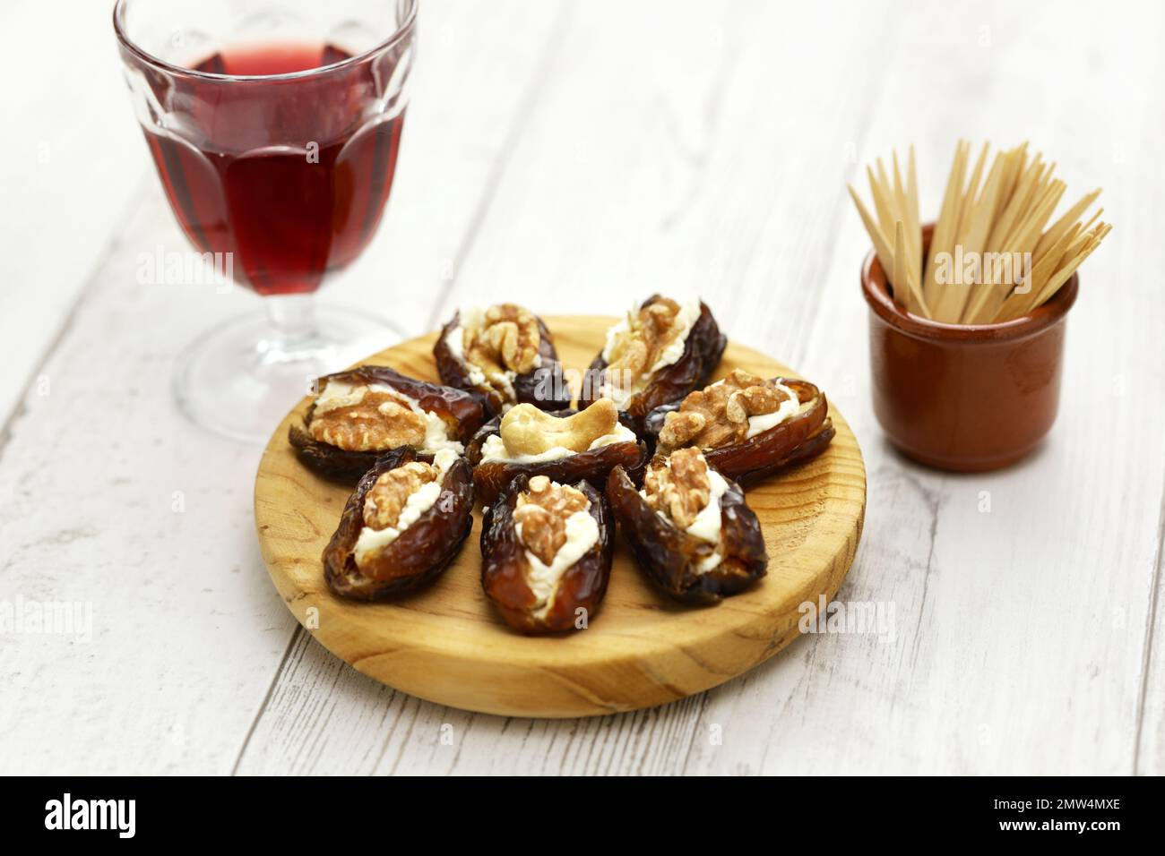 stuffed dates with cream cheese and nuts, appetizer Stock Photo - Alamy