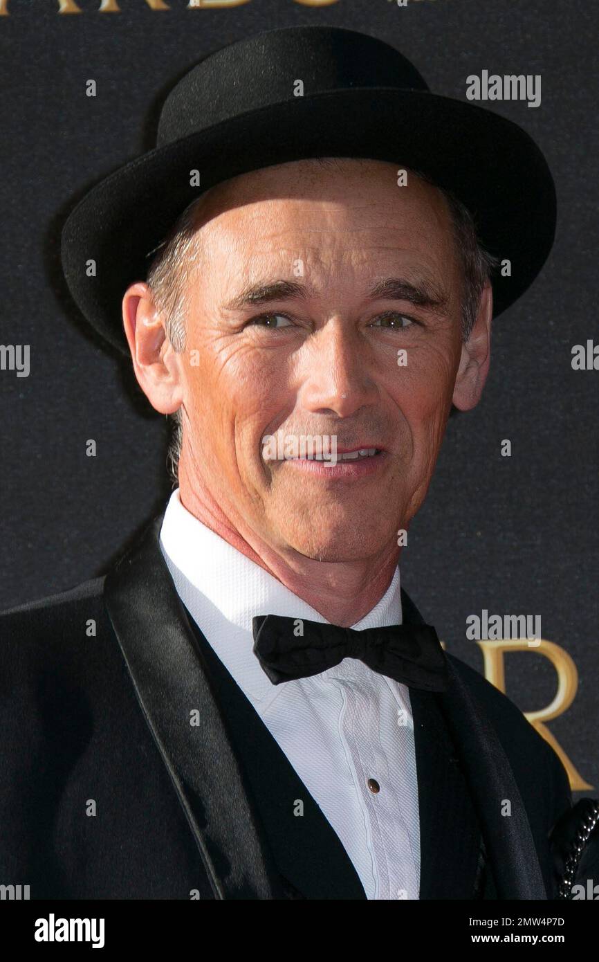 Mark Rylance poses for photographers as he arrives for the Olivier ...