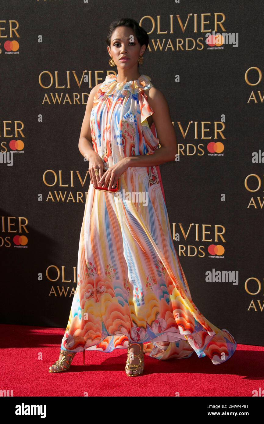 Lily Frazer poses for photographers as she arrives for the Olivier ...