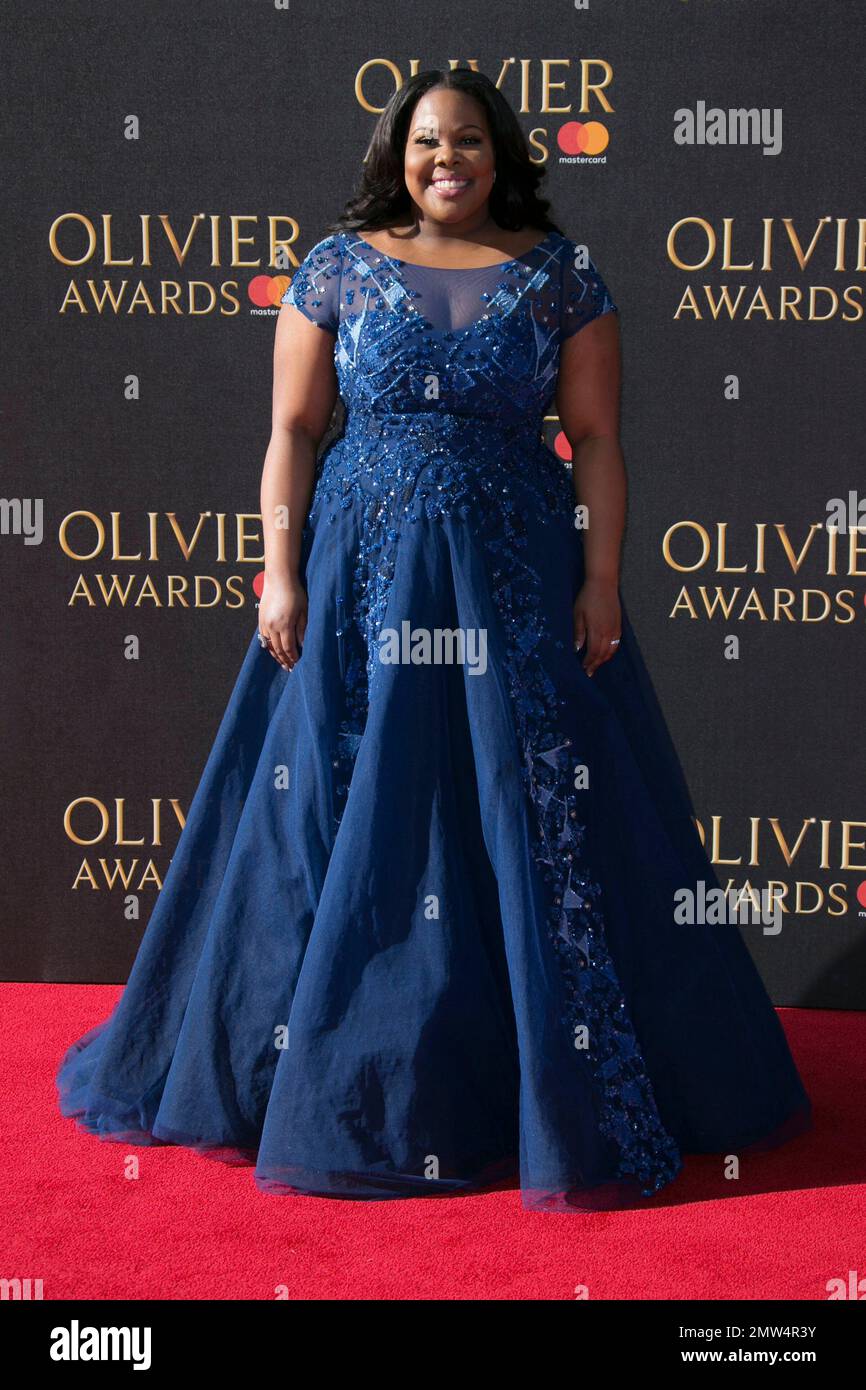 Amber Riley poses for photographers upon arrival at the Olivier Awards ...
