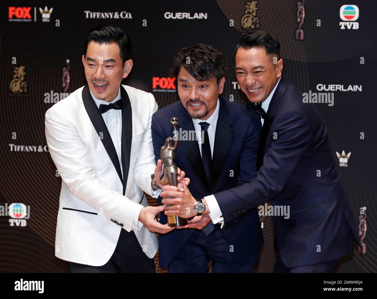 Hong Kong actor Gordon Lam, center, poses with his colleagues actors ...
