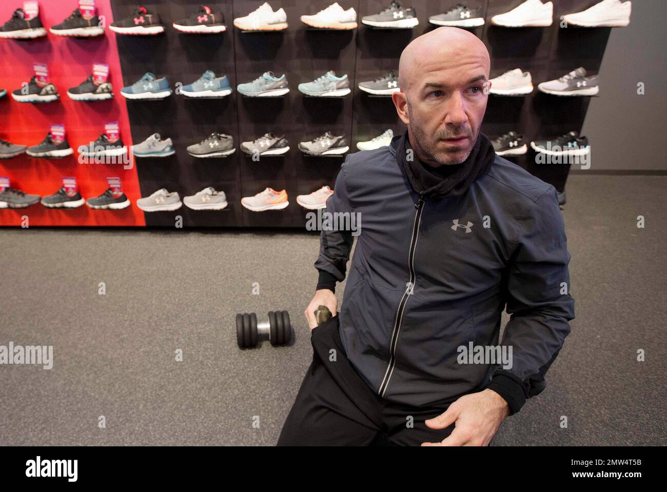 In this March 18, 2017 photo, Danny Dwyer warms up in an Under Armour ...
