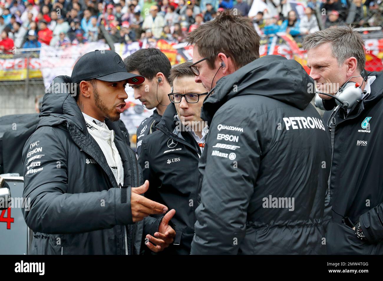 Mercedes driver Lewis Hamilton of Britain talks to his team's crew at ...