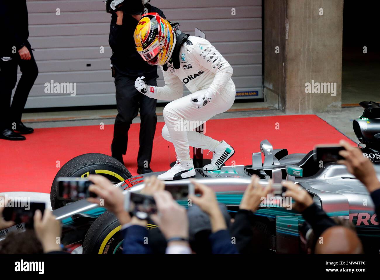 Mercedes driver Lewis Hamilton of Britain celebrates on his car after ...