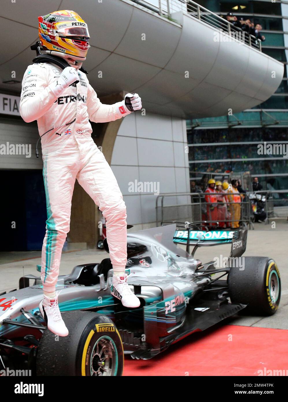 Mercedes driver Lewis Hamilton of Britain jumps off his car at parc ...
