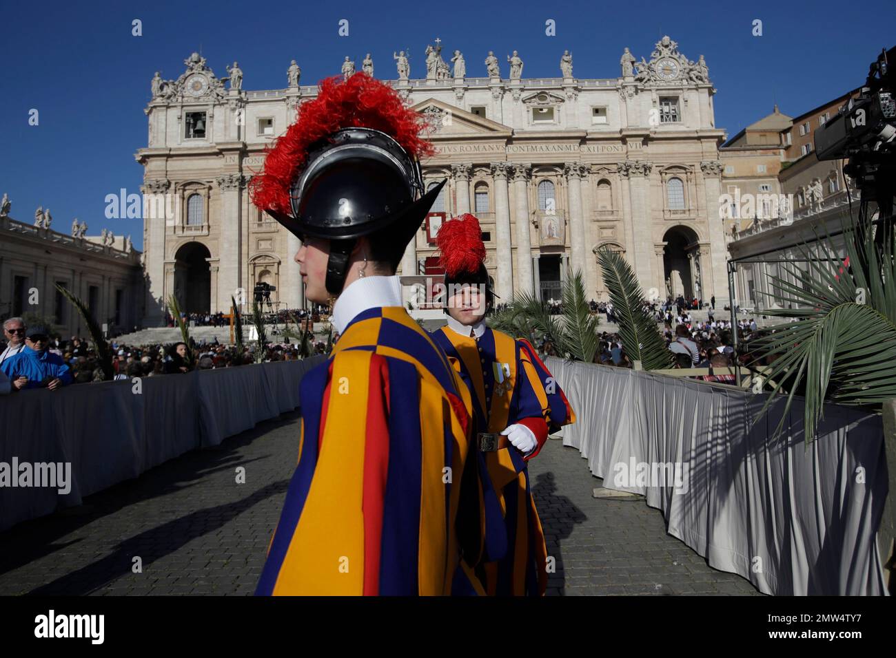 Swiss Guards stand in front of St. Peter's Basilica prior to a Mass to ...
