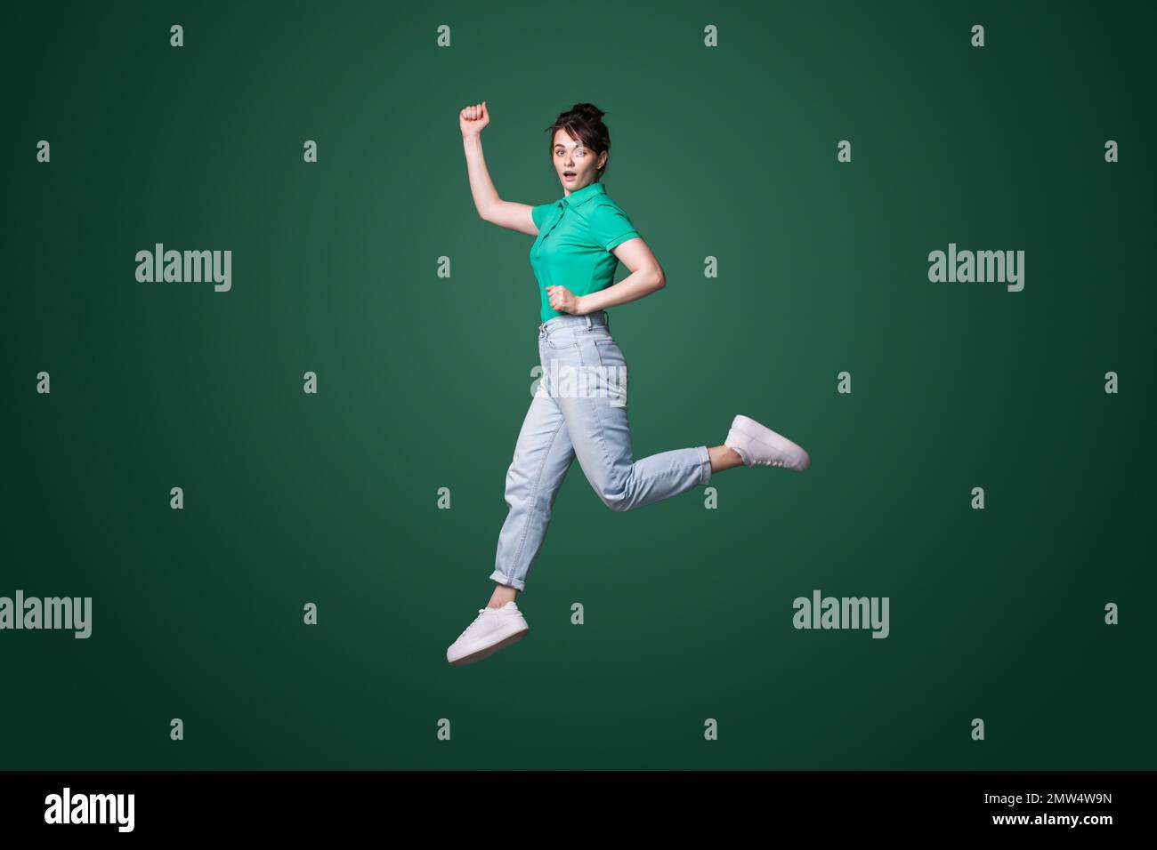Full body profile side photo of young woman jumping with shocked face ...