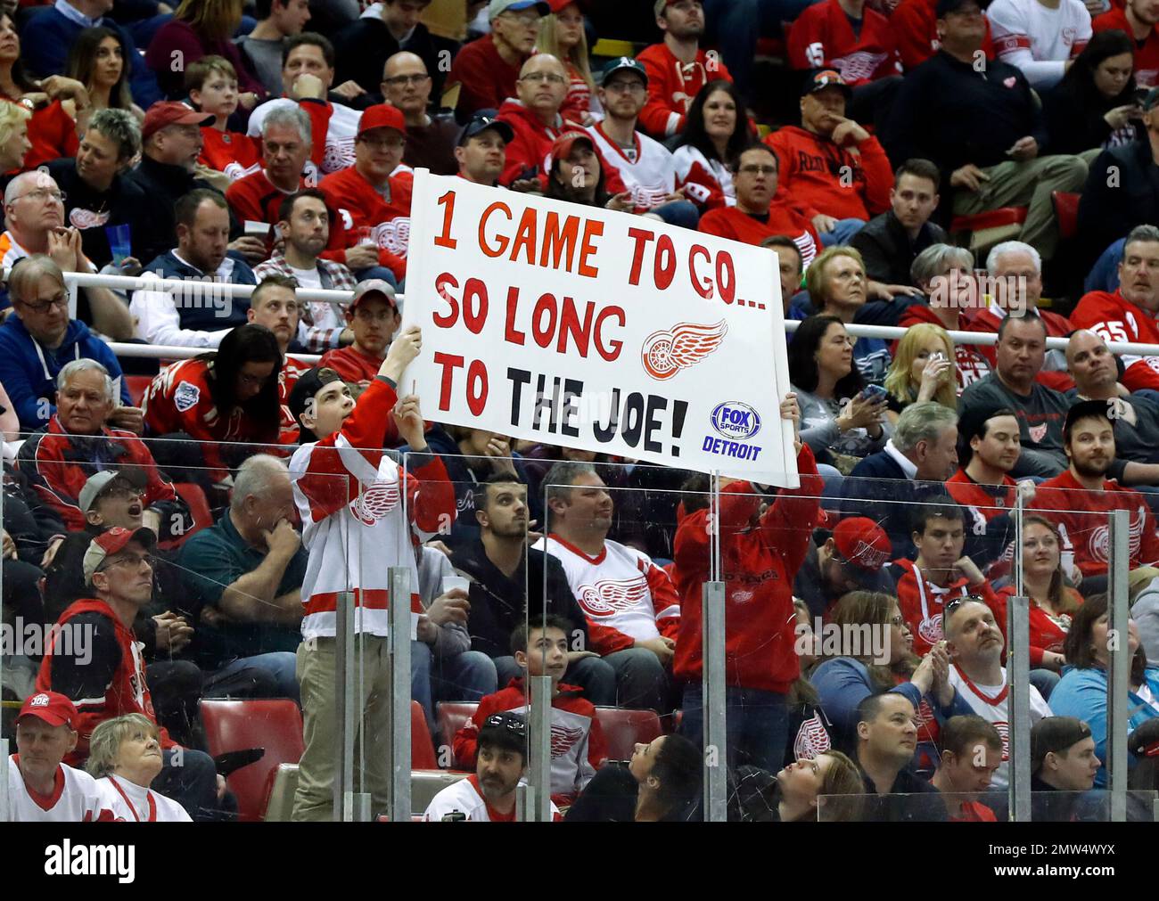 Detroit Red Wings fans hold a sign in the third period of an NHL hockey ...
