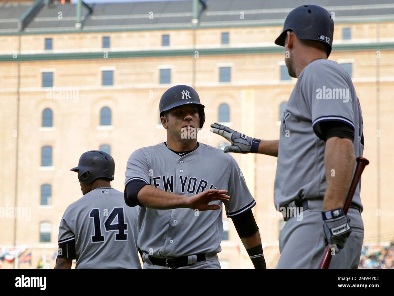 New York Yankees' Austin Romine, center, high-fives teammate Chase ...