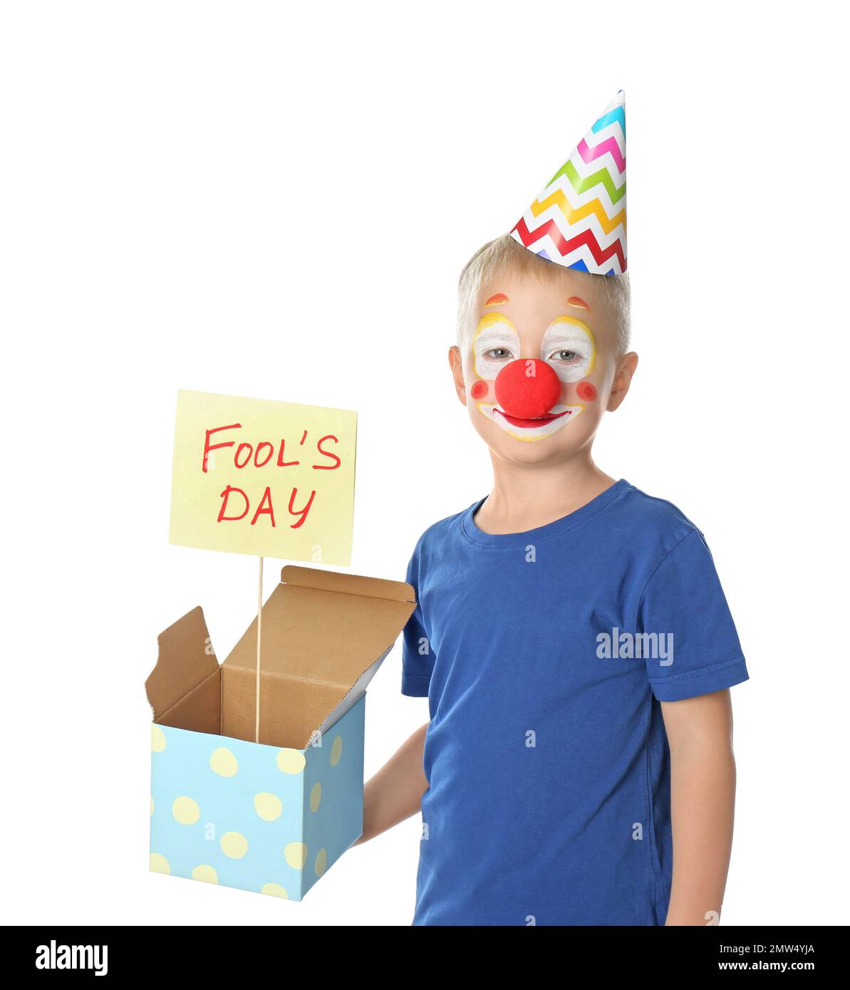 Little boy with clown makeup holding April fool's day sign on white ...