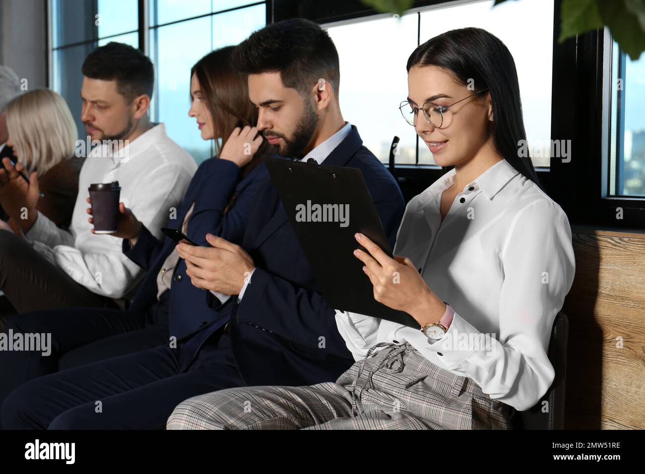People waiting for job interview in office hall Stock Photo - Alamy