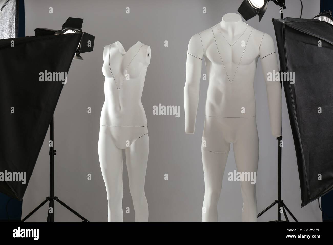 Ghost mannequins and professional lighting equipment in modern photo studio Stock Photo - Alamy