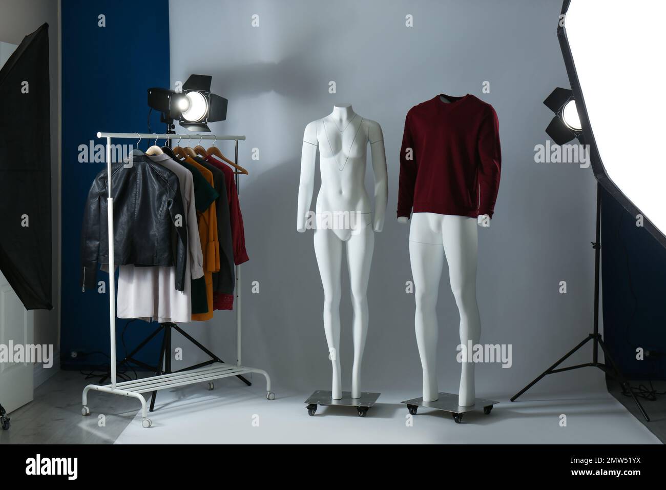 Ghost mannequins, clothes and professional lighting equipment in modern photo studio Stock Photo ...