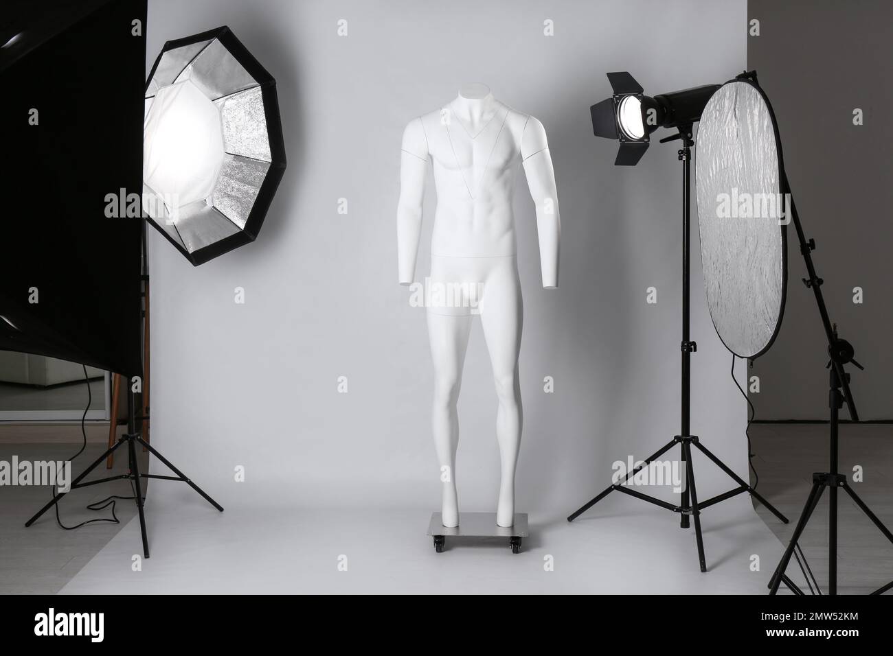 Ghost mannequin and professional lighting equipment in modern photo ...
