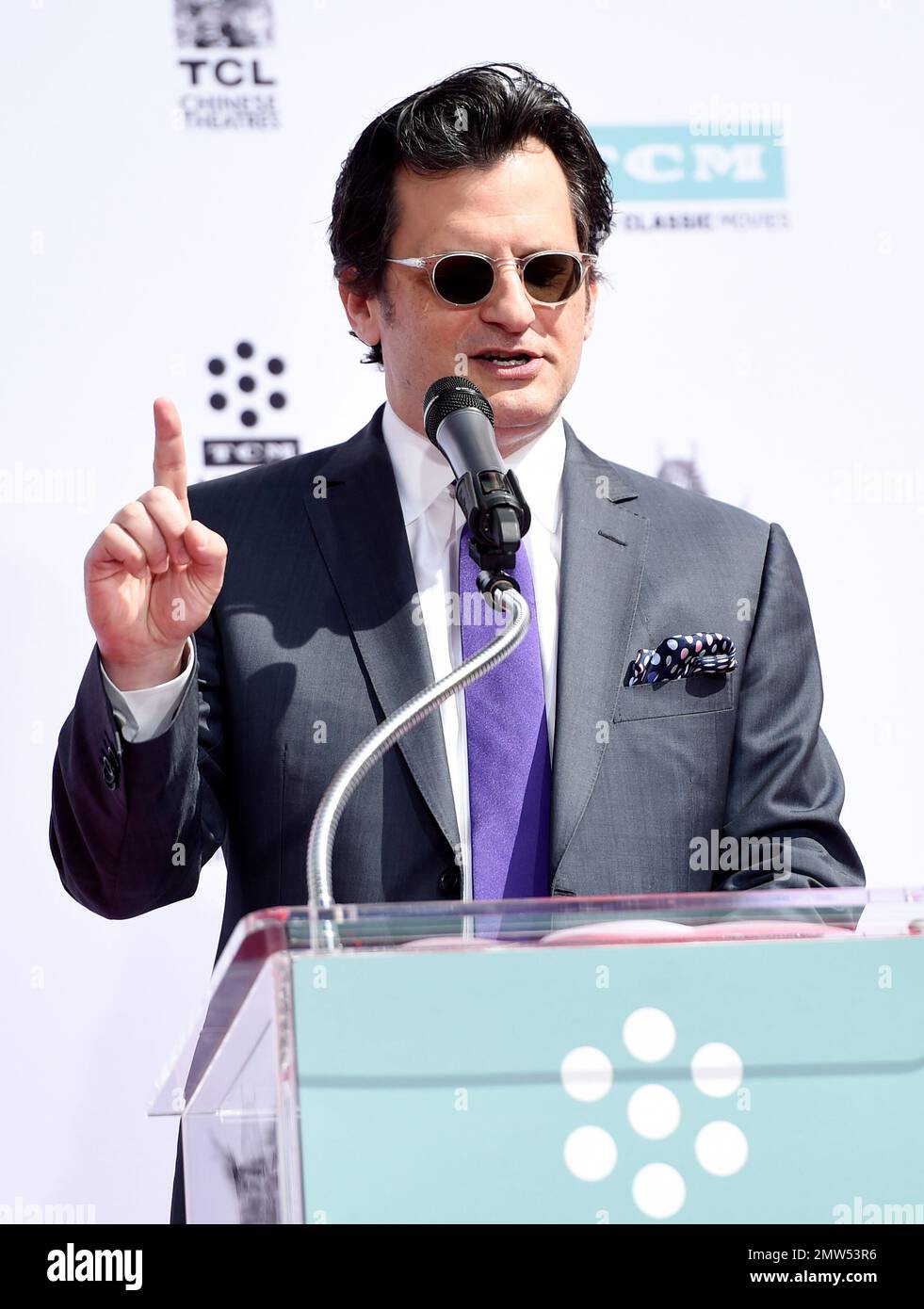 TCM host Ben Mankiewicz addresses the crowd during a hand and footprint ...