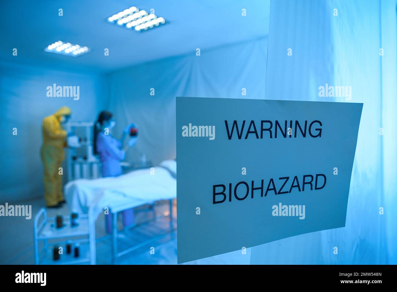 Sign with words WARNING BIOHAZARD near quarantine ward. Virus awareness ...
