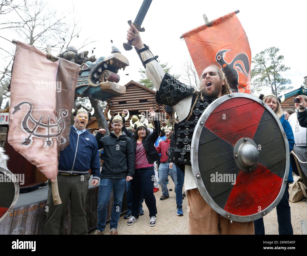 An actor portrays a Viking along with roller coaster fans during the ...