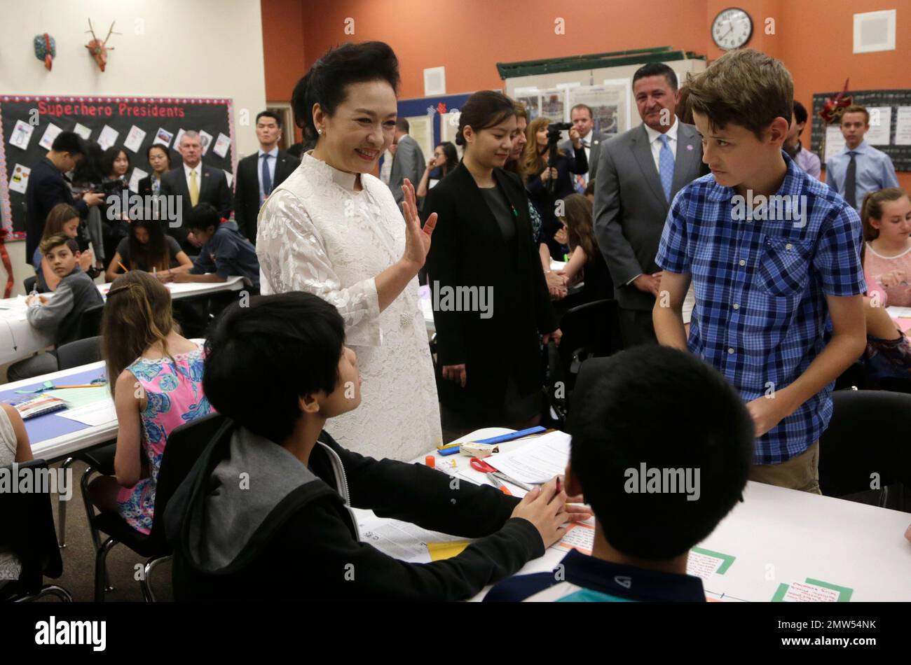 Peng Liyuan wife of Chinese president Xi Jinping, greets students in a ...