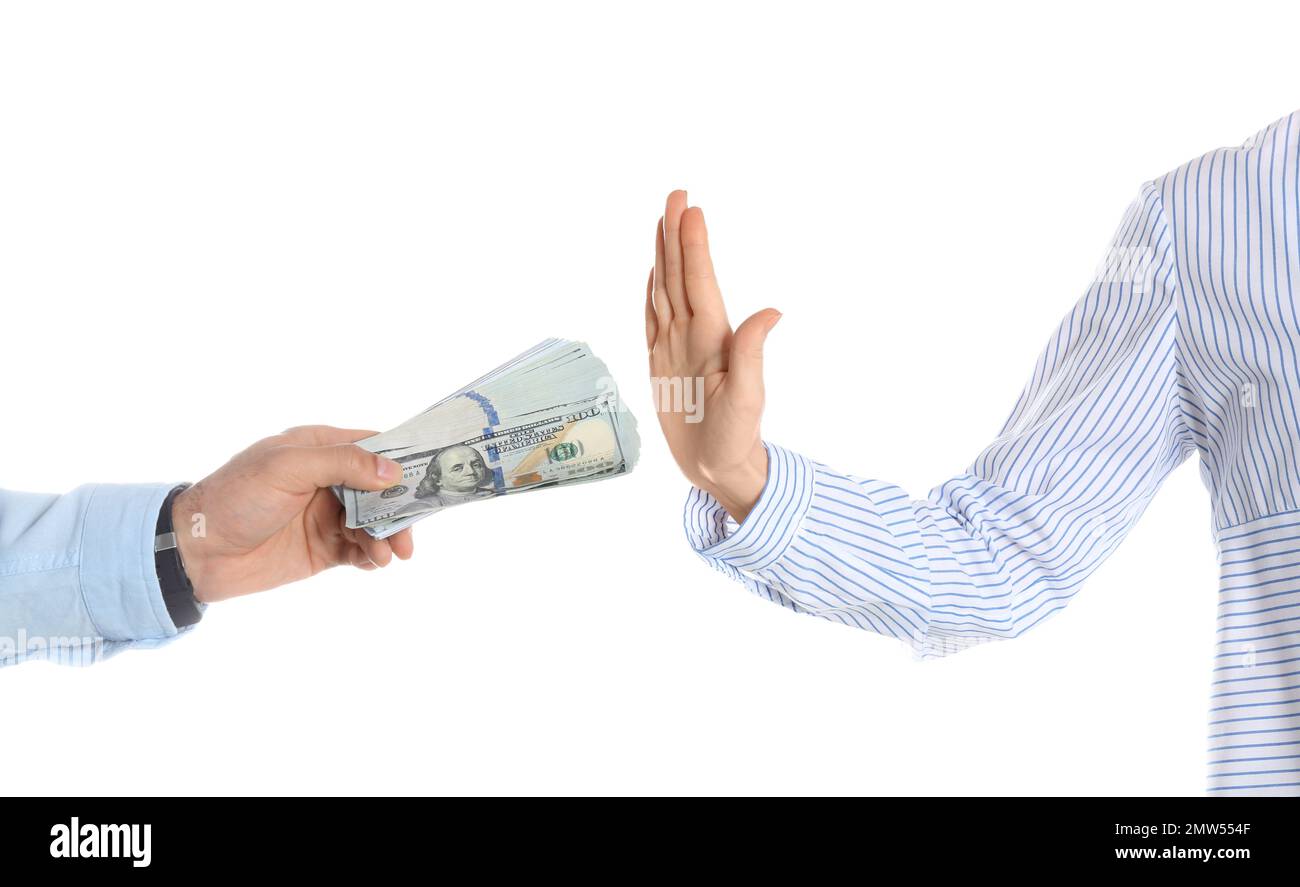 Woman refusing to take bribe on white background, closeup of hands ...