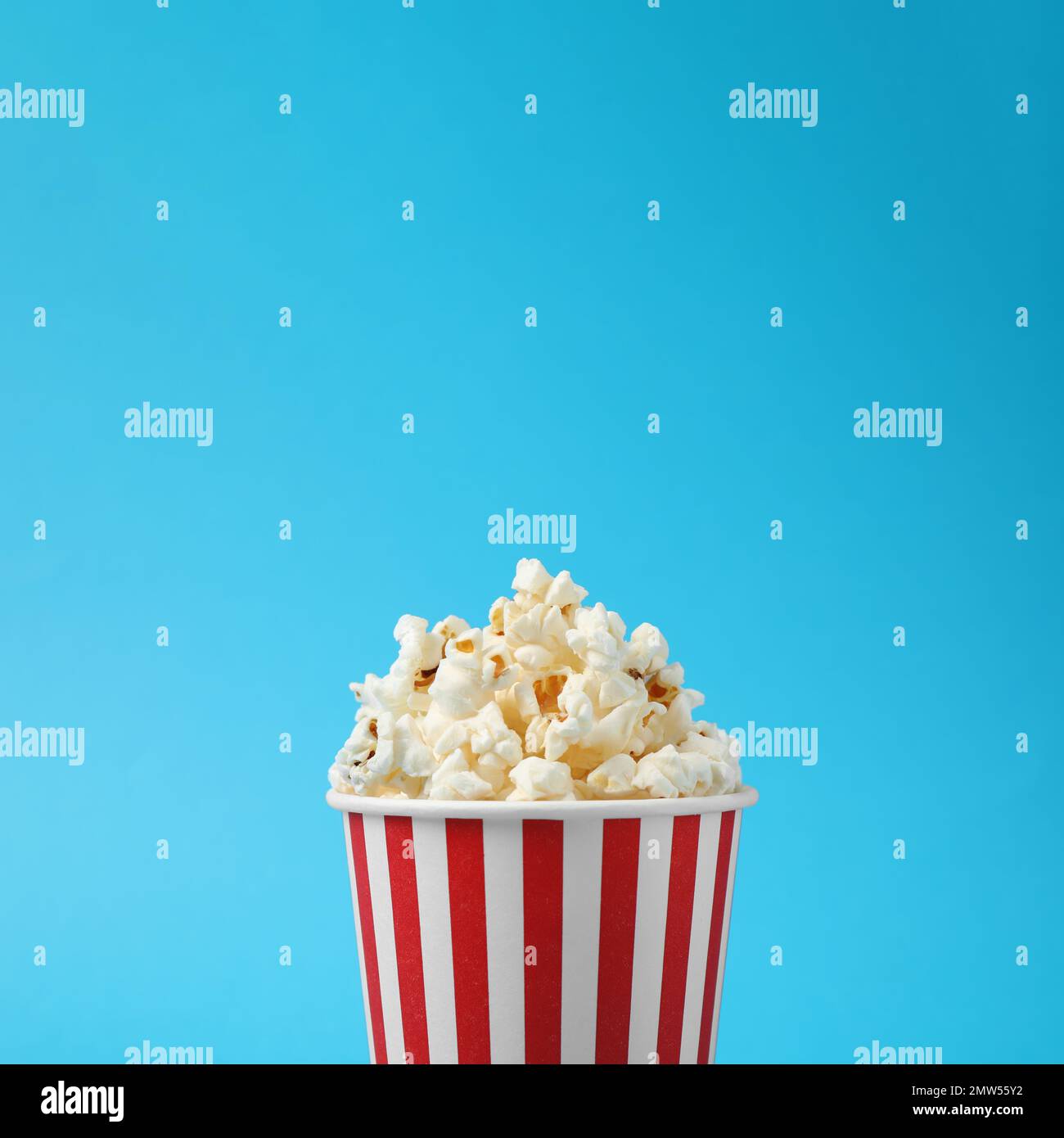 Delicious popcorn on light blue background, closeup Stock Photo - Alamy
