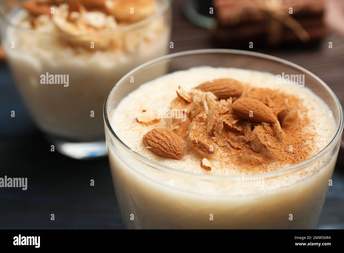 Delicious rice pudding with almonds and cinnamon, closeup Stock Photo ...
