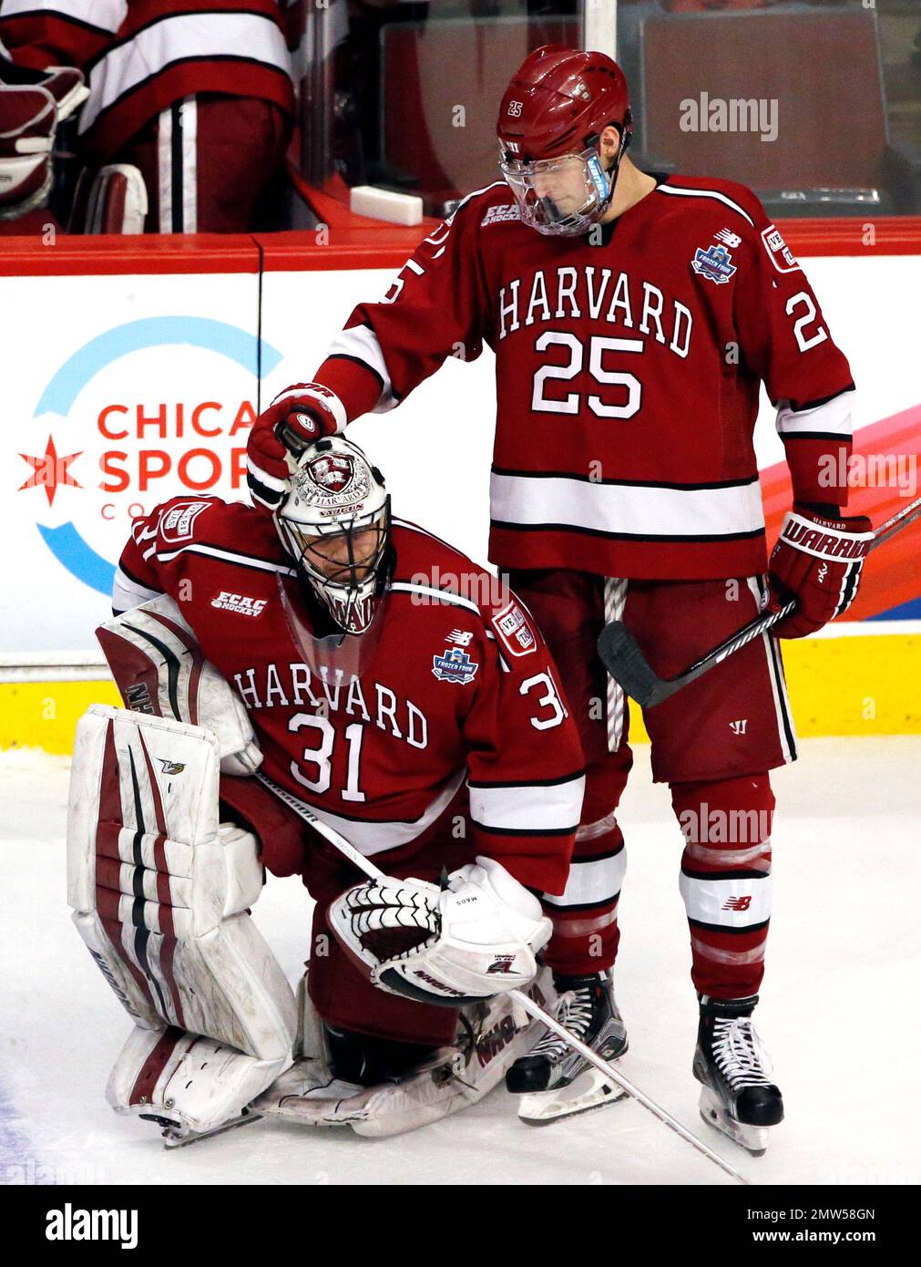 Harvard goalie Merrick Madsen, left, and defenseman Wiley Sherman react ...