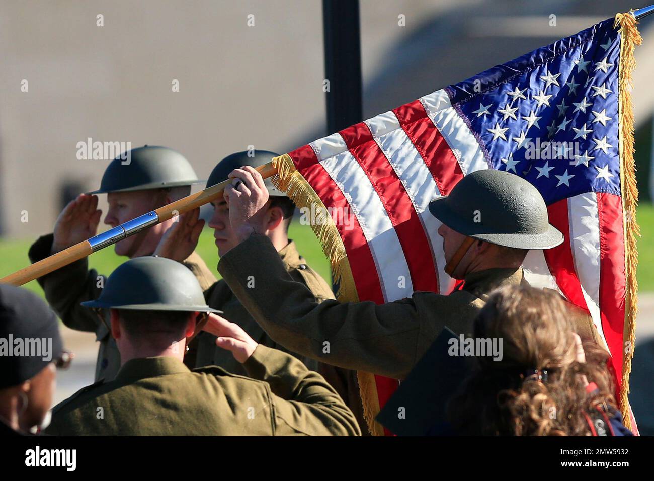 Members of the 1st Infantry Division color guard uncase colors while ...