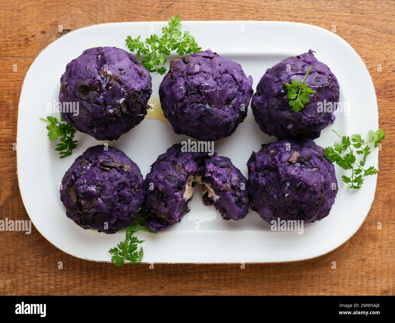 Purple Potato Balls filled with Vegan Feta Cheese Stock Photo - Alamy
